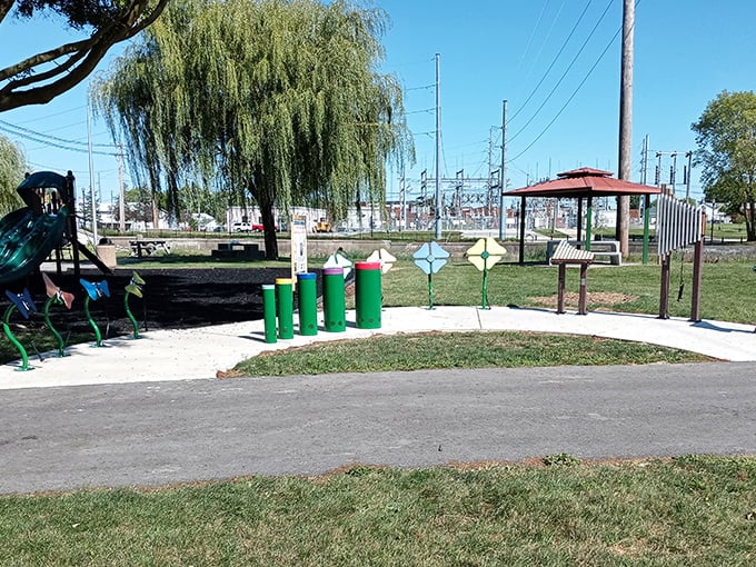 Belcher Park offers a peaceful respite with simple pleasures. Those green tubes aren't modern art&mdash;they're the launch pads for tomorrow's imaginations.