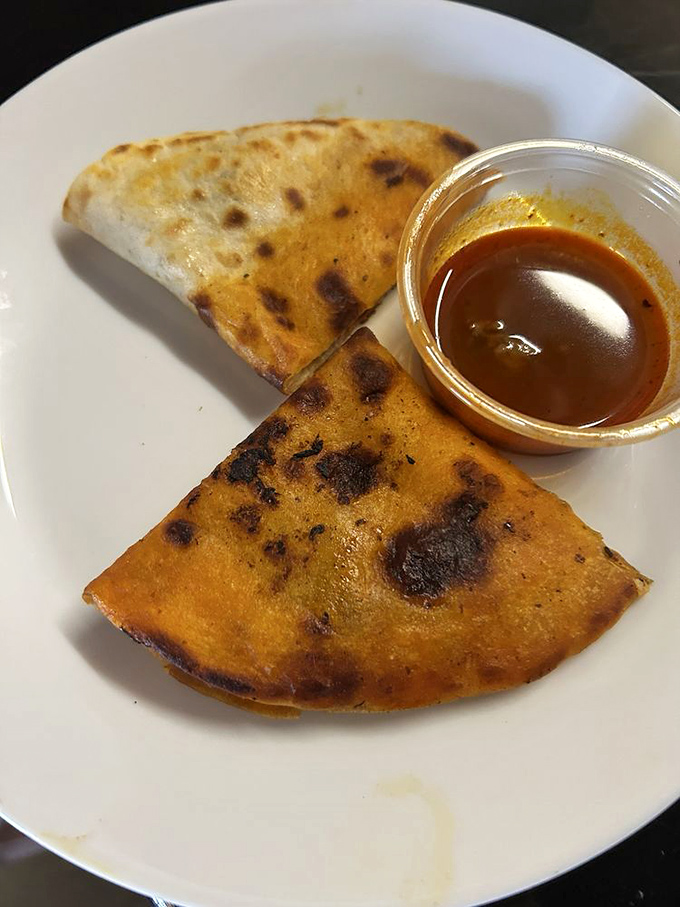 Birria that doesn't just ask for a dip—it demands full tortilla submersion in that rich, complex consommé.