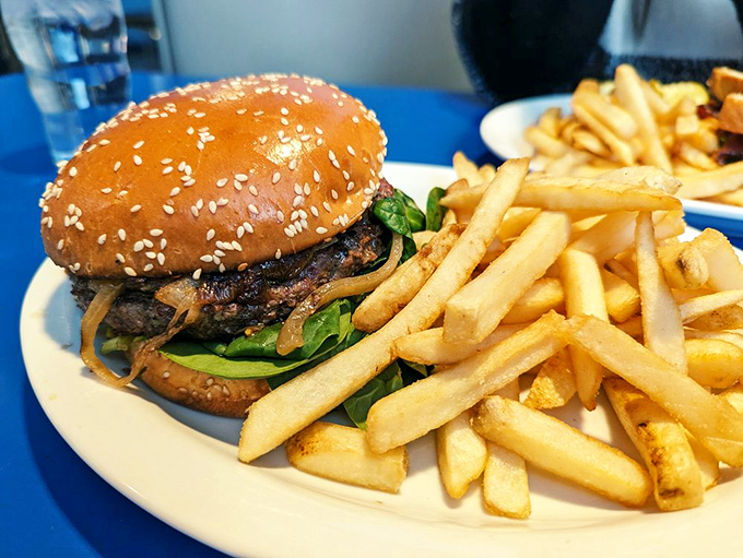 This burger isn't just food&mdash;it's architecture. The sesame seed bun like a dome atop a temple dedicated to the art of comfort food.