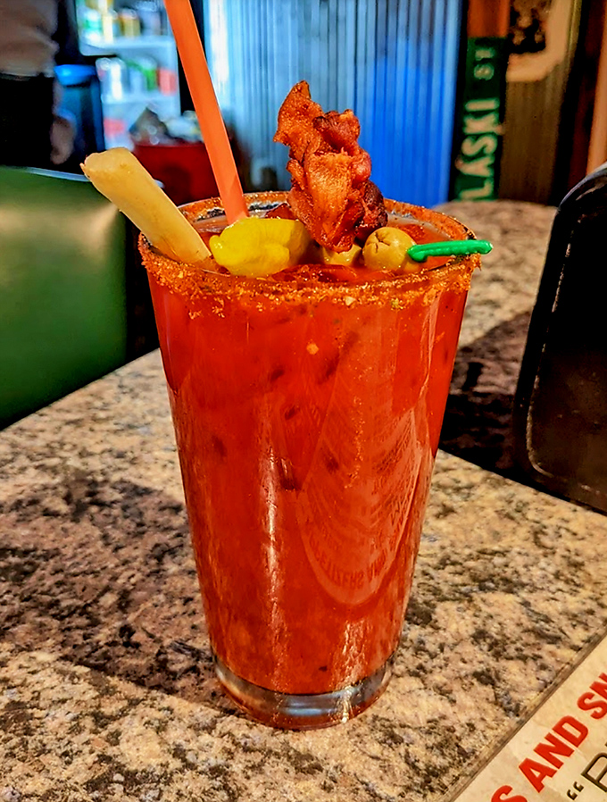 A Bloody Mary that doubles as a meal, complete with what appears to be bacon garnish. Sunday brunch just got serious.