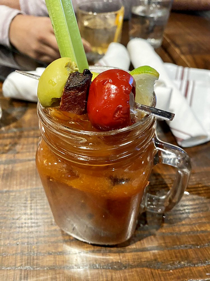 A Bloody Mary that's practically a meal, complete with a skewer of garnishes that could qualify as a small appetizer plate.