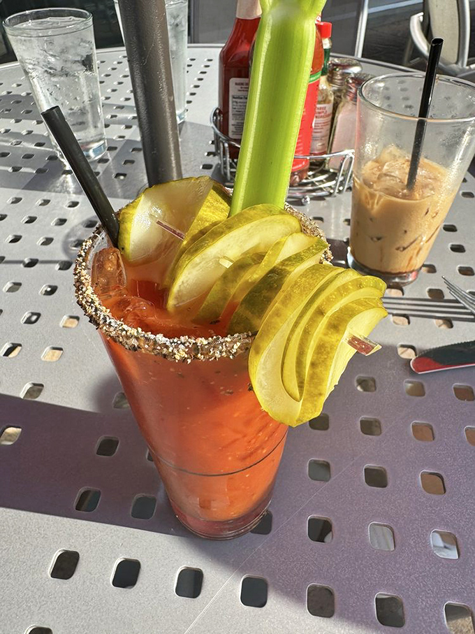 This Bloody Mary isn't just a drink, it's an architectural achievement with enough garnish to qualify as its own food group.