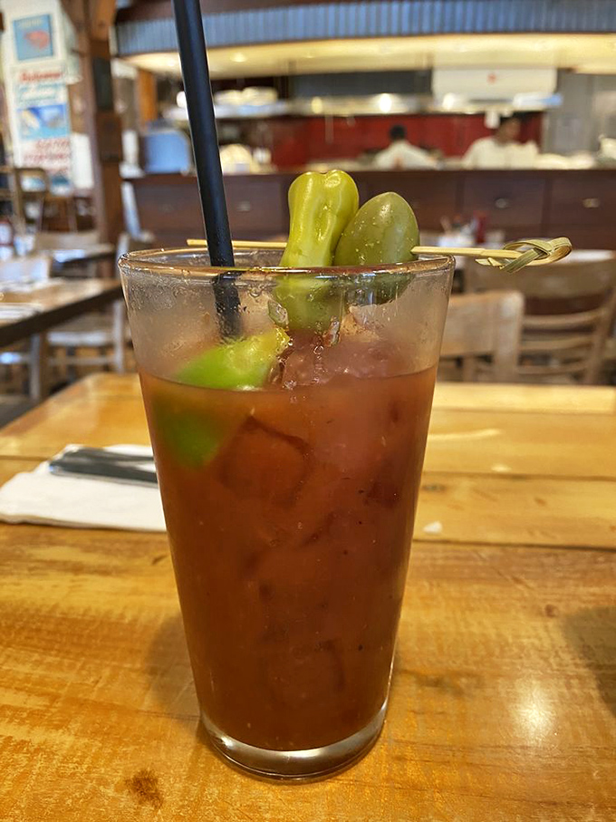 A Bloody Mary that doubles as an appetizer, with those pickled green beans standing at attention like they're guarding liquid treasure.