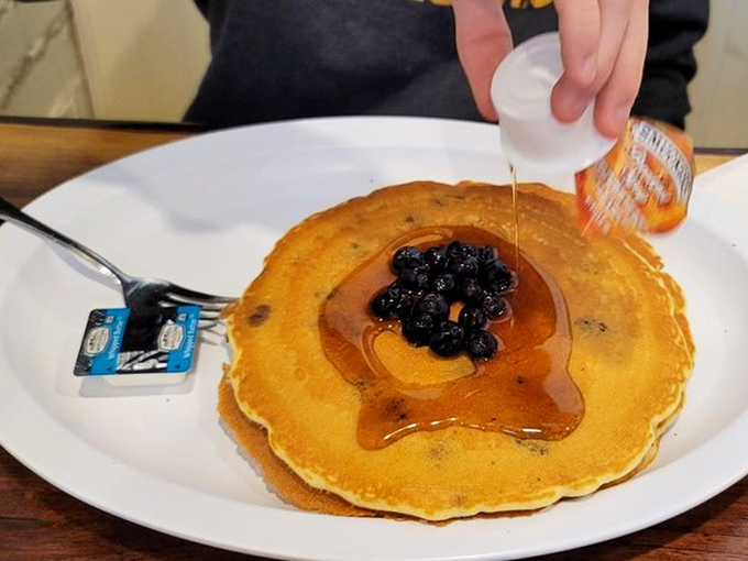 Blueberry pancakes getting the maple syrup treatment they deserve. Those berries aren't just toppings&mdash;they're little purple flavor bombs.