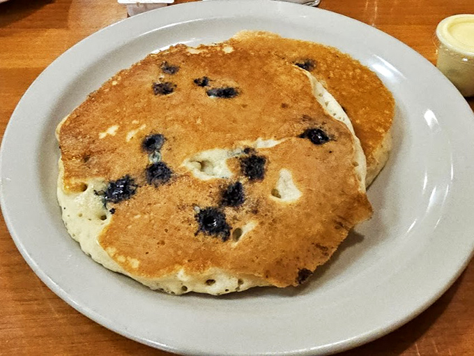 Blueberry pancakes that make you wonder why anyone bothers with plain ones. The perfect canvas for maple syrup rivers.