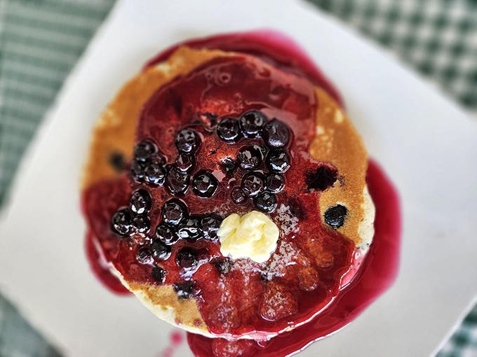 These blueberry pancakes don't just have berries &ndash; they've formed a delicious pact with them, sealed with butter and that glorious crimson sauce.