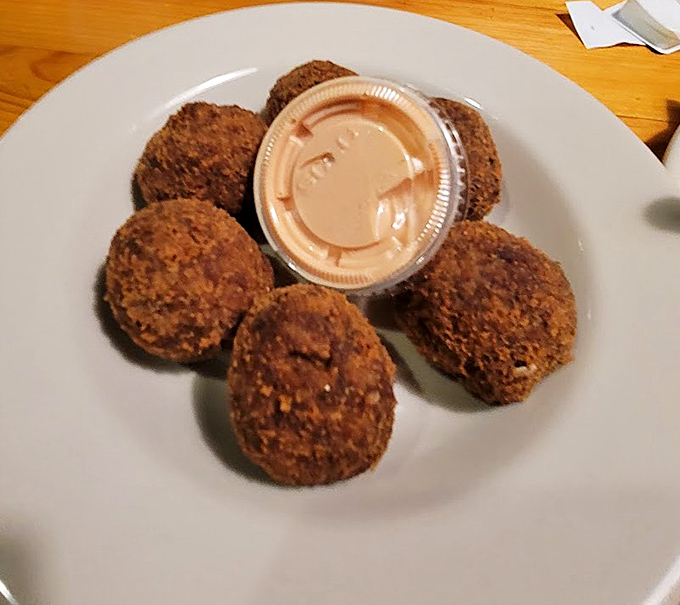 Boudin balls that look innocent enough until you bite in and discover why Louisianans guard their recipes like family secrets.