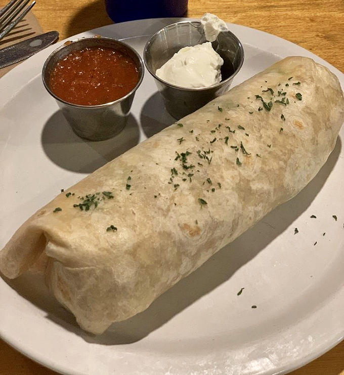A breakfast burrito so perfectly wrapped it could teach a class on how to properly tuck in bedsheets.
