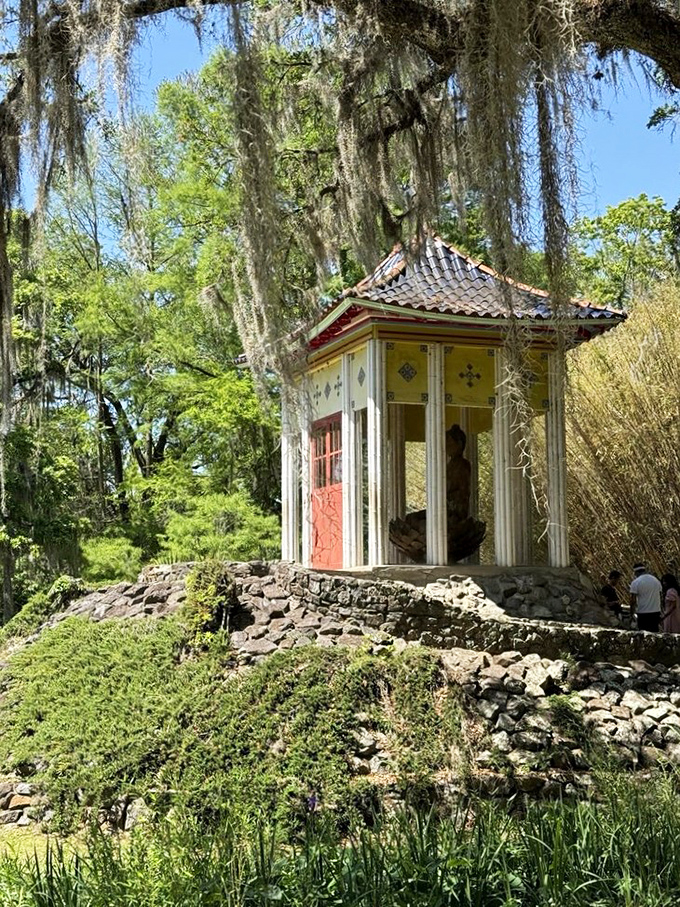 The Buddha shrine sits serenely among Spanish moss, proving that inner peace works in any climate, even humid Southern afternoons.