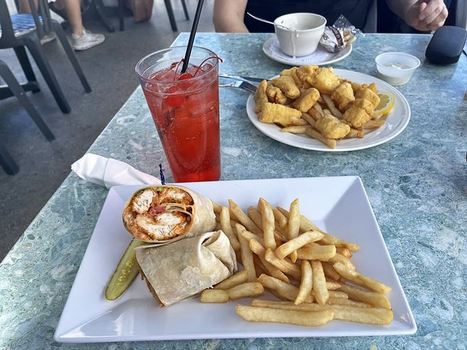 When a wrap means business: buffalo chicken nestled in a tortilla with crispy fries standing guard. Lunch that demands to be noticed.