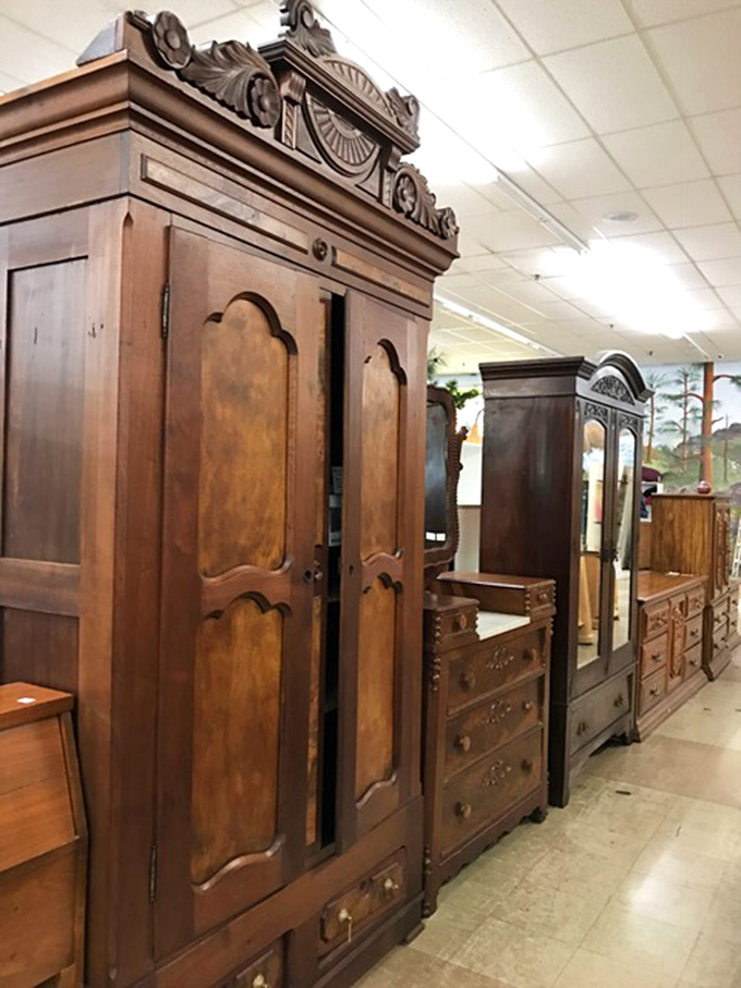 Antique cabinet row showcases craftsmanship from an era when furniture was built to become heirlooms. These wooden giants have stories etched in every grain. 