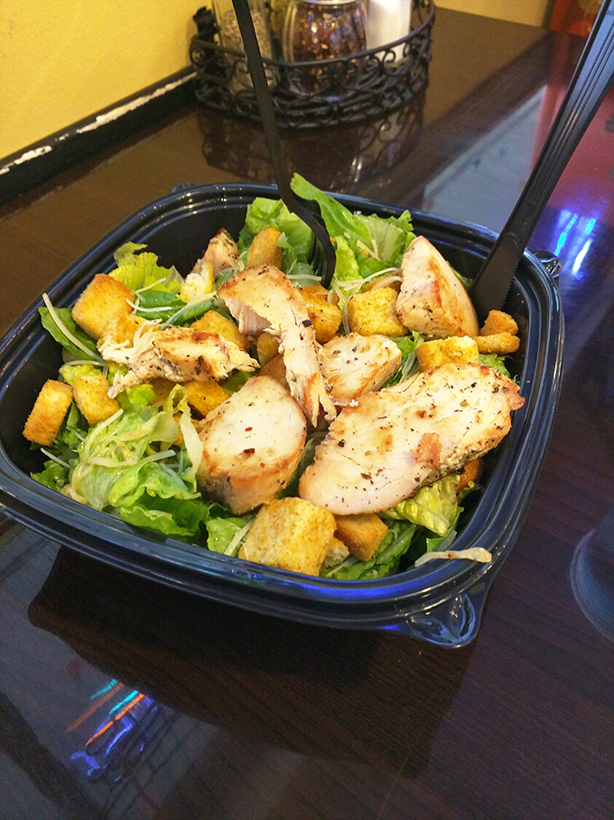 Even their Caesar salad means business—generous chicken, fresh greens, and enough croutons to make a Roman emperor smile.