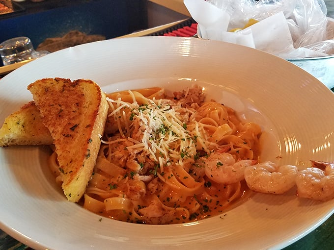 Cajun Alfredo pasta that proves cheese and seafood can be friends&mdash;very, very good friends. That garlic bread is just showing off.