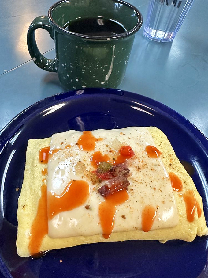 This omelet doesn't just contain ingredients &ndash; it showcases them, with hot sauce adding personality like a sassy friend who always tells the truth.