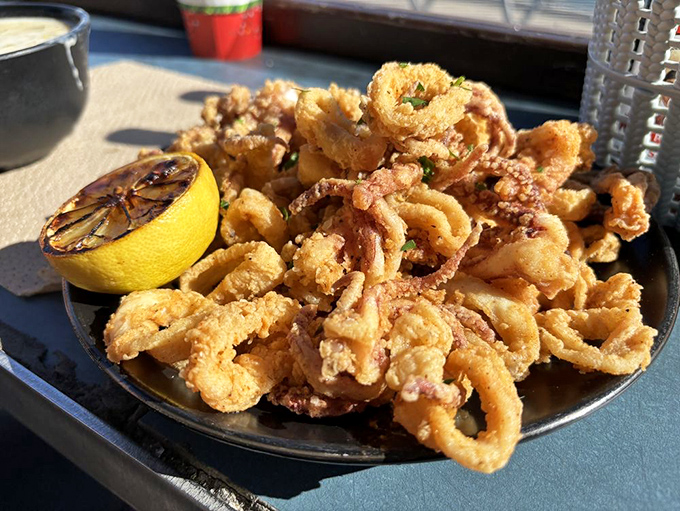 Calamari that's traveled from mysterious ocean depths to crispy golden perfection on your plate. No rubber bands here, just tender rings of joy.