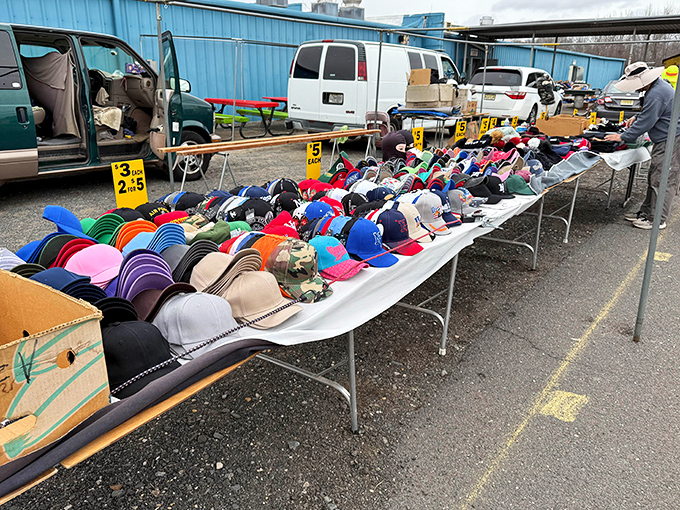 A sea of headwear for every personality—from fishing enthusiasts to sports fanatics—all priced at what appears to be three for $15.