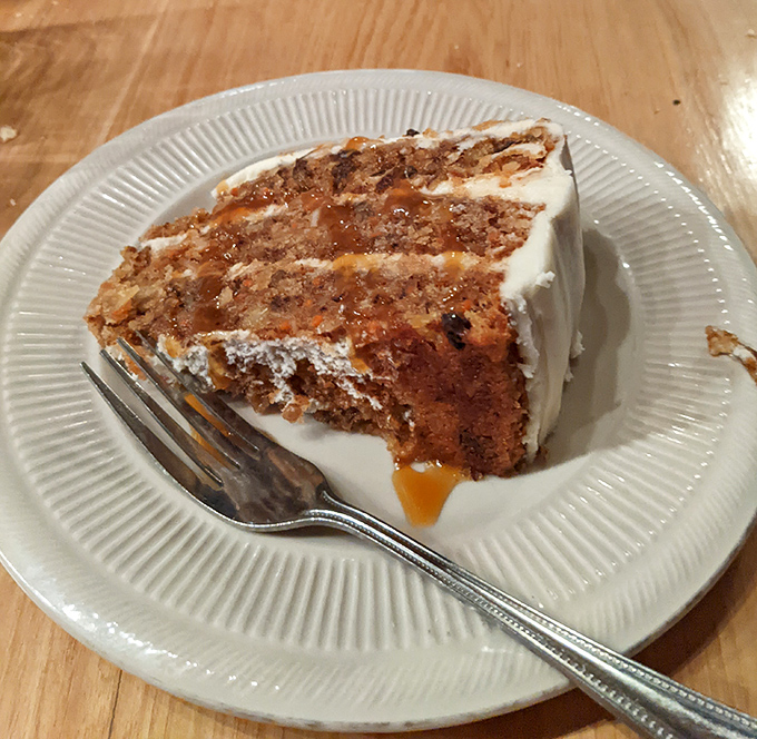 A slice of carrot cake that makes you wonder if vegetables were always meant to be dessert.