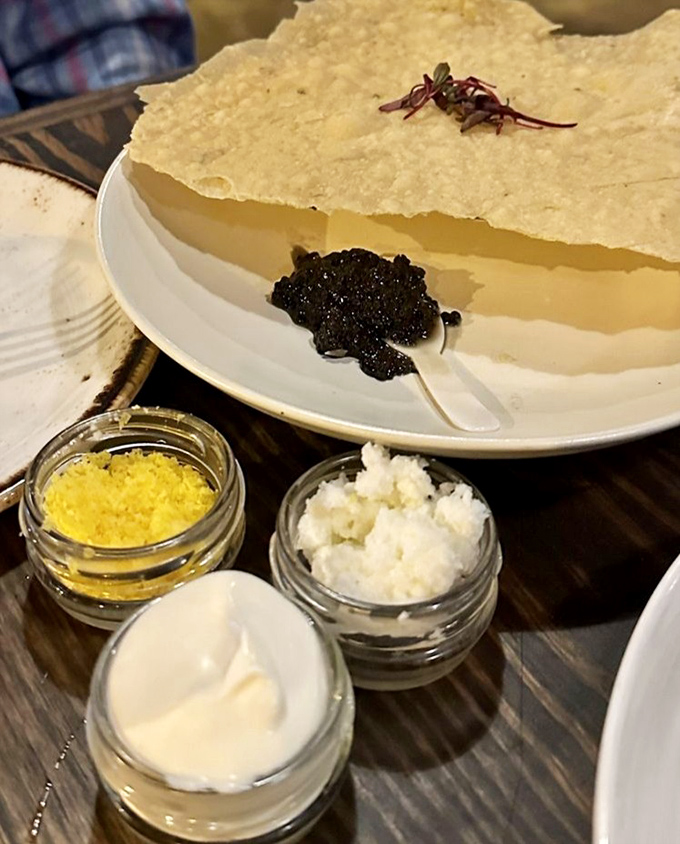 Caviar service that makes you feel like royalty without the responsibility. Those tiny black pearls pack more flavor than foods ten times their size.