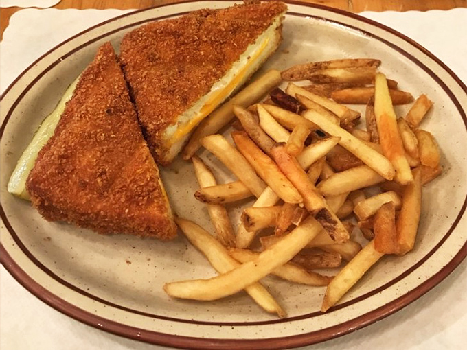 The humble grilled cheese elevated to art form &ndash; crispy, golden perfection paired with fries that disappear one "last one" at a time.