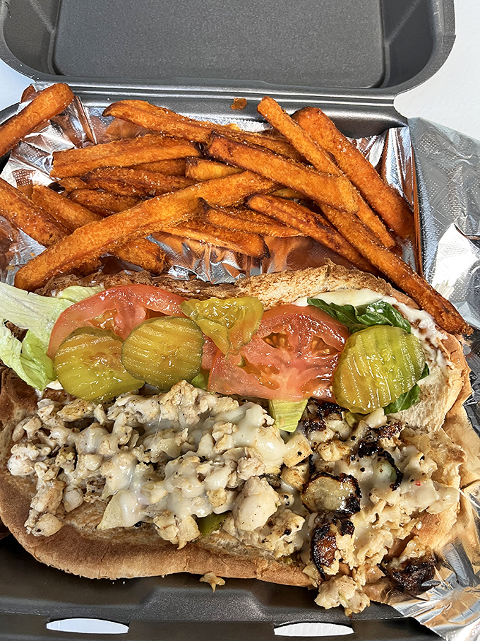 This chicken cheese steak sandwich isn't messing around. Piled high with melty goodness and fresh veggies, it's the kind of lunch that makes afternoon meetings completely optional.