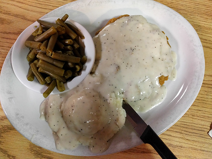 Country-fried steak with pepper gravy: where a humble cut of beef puts on formal wear and transforms into something magnificent.