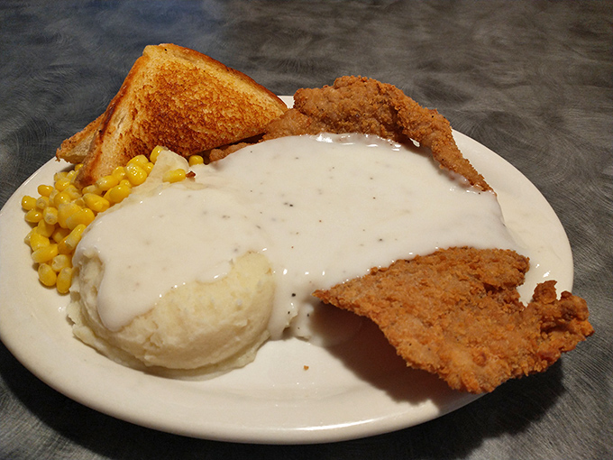 Chicken fried steak swimming in creamy gravy &ndash; a dish so comforting it should come with its own therapist's license.
