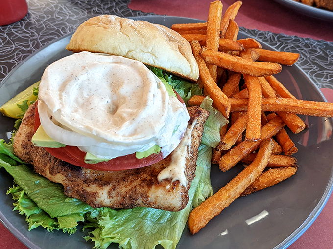 Not just a sandwich, but a towering monument to the perfect chicken cutlet, with a dollop of sauce that says, "You made the right choice."