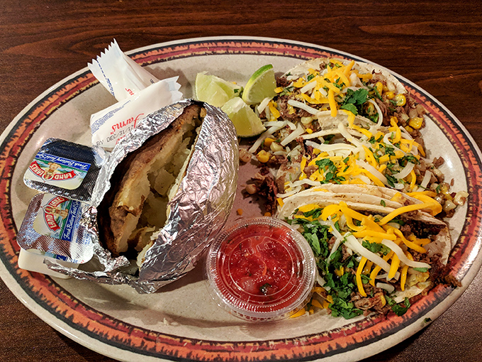 This plate combines the best of Tex-Mex and barbecue traditions—proof that cultural fusion is America's true superpower. The foil-wrapped potato is the unsung hero here.