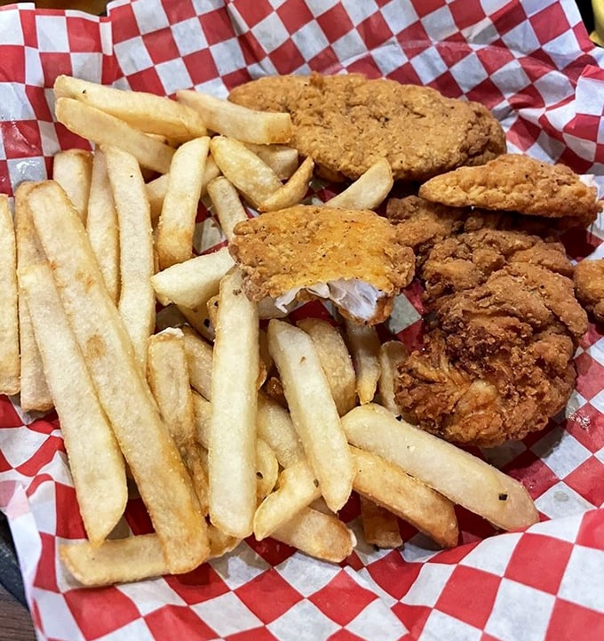Chicken strips and fries served in the classic red-checkered basket&mdash;proof that sometimes the simplest pleasures are the most satisfying.