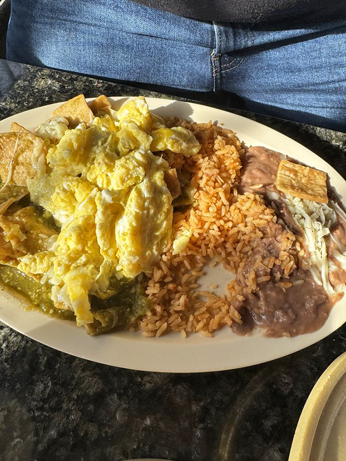 These chilaquiles transform yesterday's tortillas into today's breakfast masterpiece, with eggs, salsa verde, and a sprinkle of queso fresco sealing the deal.