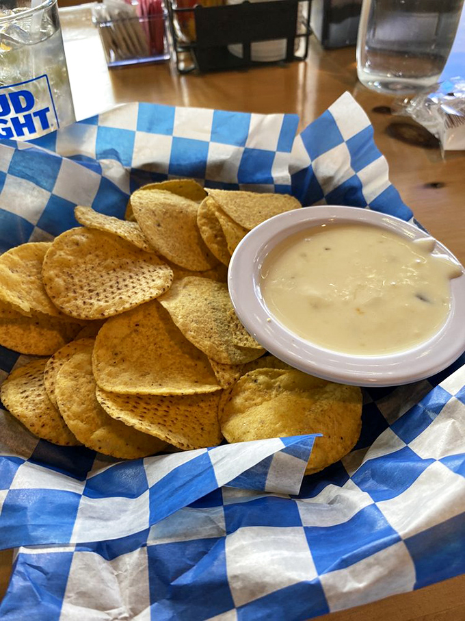 Tortilla chips surrounding queso like devoted fans at a cheese concert. This is Wisconsin's version of a spiritual experience.