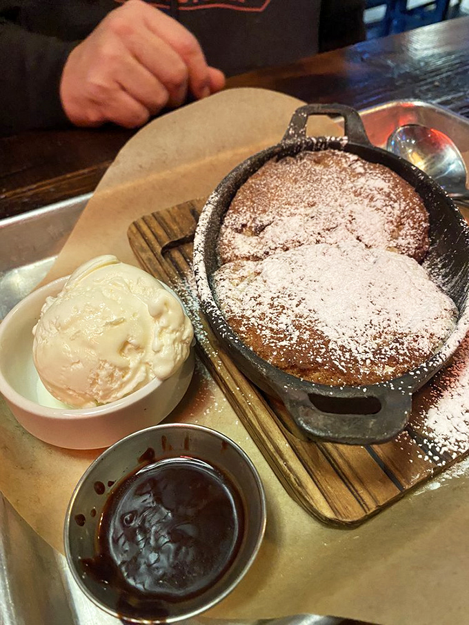This skillet cookie isn't just dessert; it's therapy in cast iron form. The ice cream is melting with excitement just to be near it.