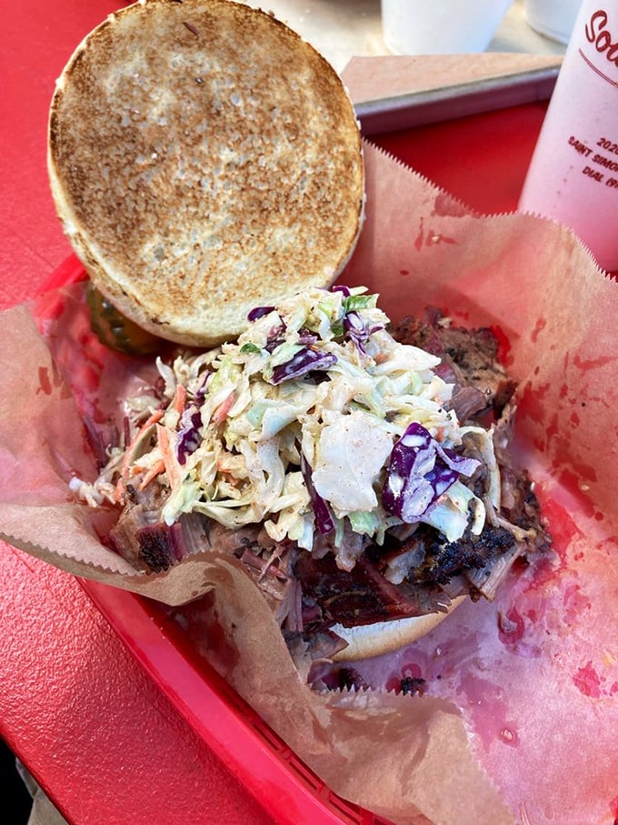 The sandwich that launched a thousand road trips. This pulled pork masterpiece with slaw is what barbecue dreams are made of.