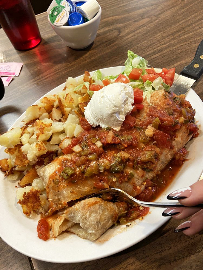 This burrito isn't just breakfast – it's a commitment, a relationship, and possibly the reason stretchy pants were invented.