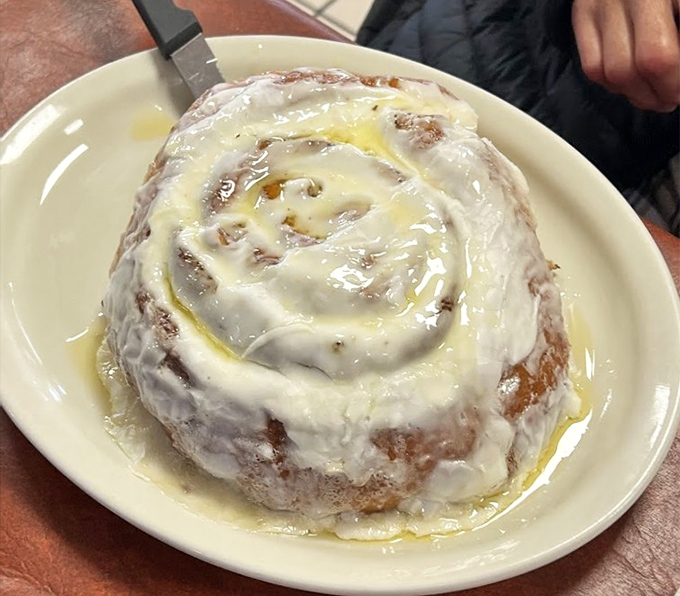 This cinnamon roll isn't just breakfast&mdash;it's dessert masquerading as a morning meal, glazed with enough sweetness to power your entire day.