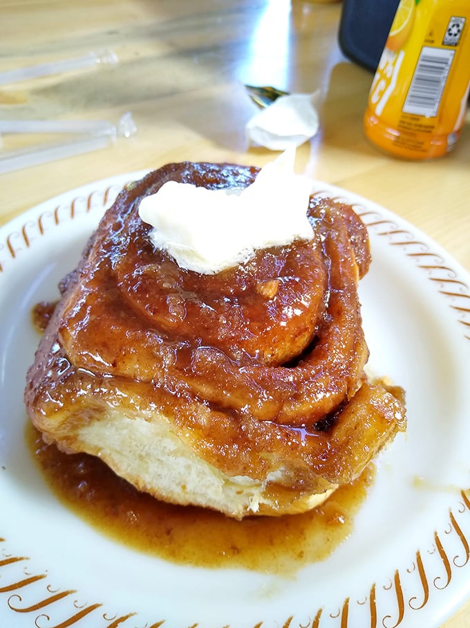 This cinnamon roll topped with butter could make a grown person cry tears of pure joy and zero regret.