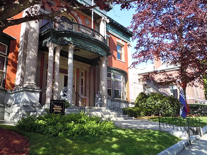 The Clinton Historical Society building stands as proudly as its columns, a brick testament to preserving stories worth remembering.