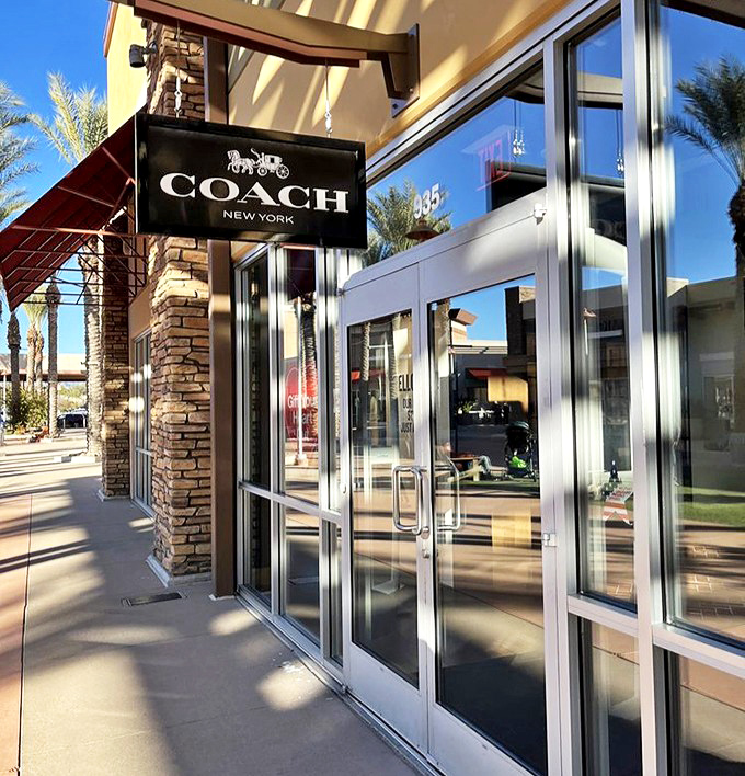 Coach's elegant storefront promises leather goods that will outlast trends and possibly your car. Quality never goes out of style.
