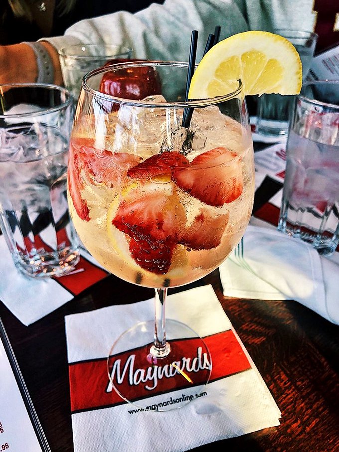 Summer in a glass: strawberries, bubbles, and a lemon twist. This drink practically demands you take the day off.