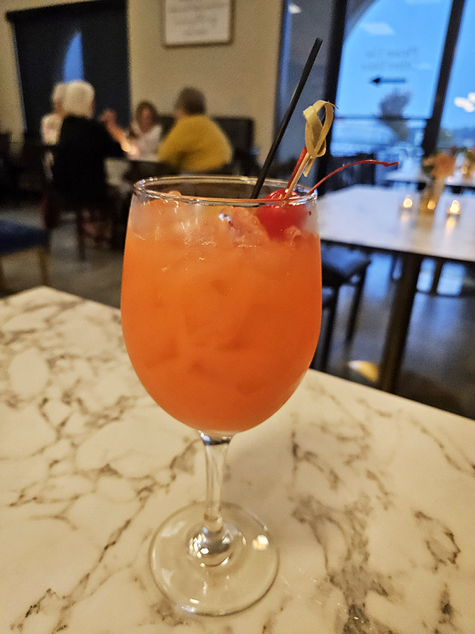 That cocktail's sunset hue promises a brunch that might stretch lazily into afternoon &ndash; exactly as the weekend gods intended.