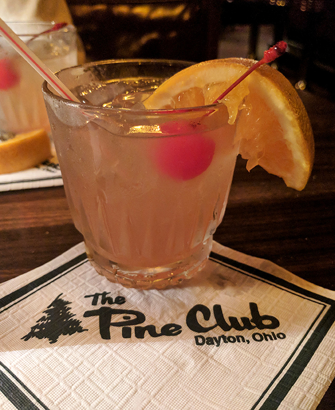 A properly made cocktail with that signature napkin &ndash; because at The Pine Club, even the drinks dress for dinner.