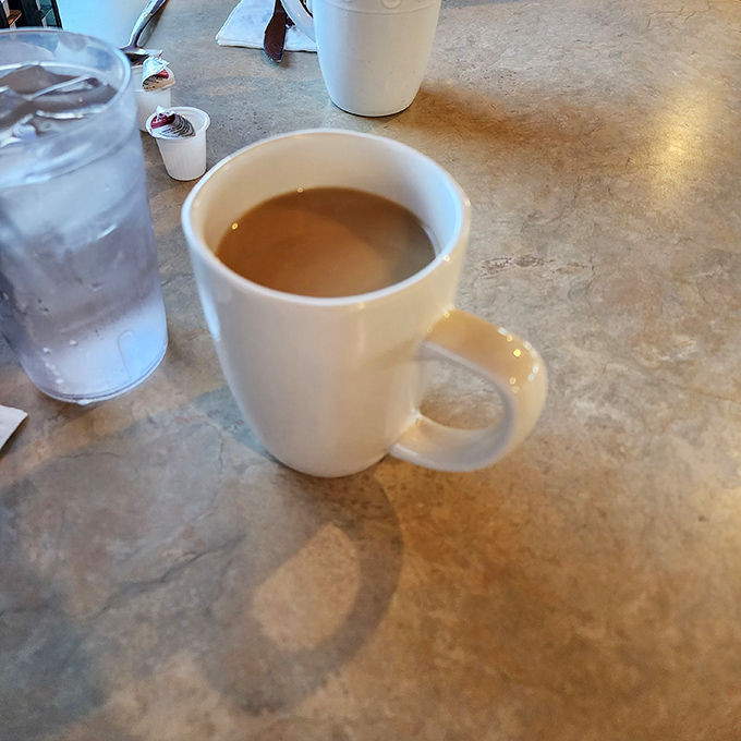 The humble coffee mug &ndash; faithful companion to countless conversations, newspaper readings, and contemplative morning moments at Reececliff's tables.