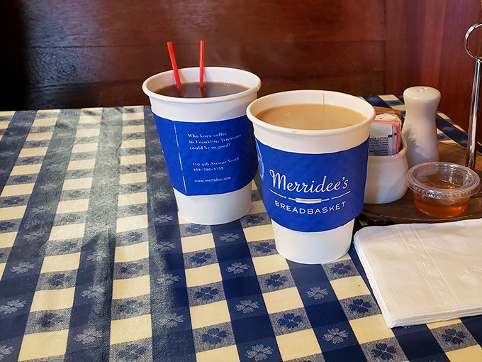Coffee served with checkered tablecloth charm. In a world of complicated coffee orders, sometimes simple pleasures win the morning.