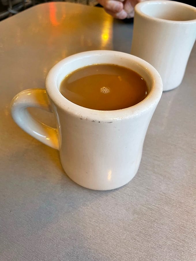 The humble diner coffee mug &ndash; unassuming vessel of liquid motivation that keeps Rochester running one refill at a time.