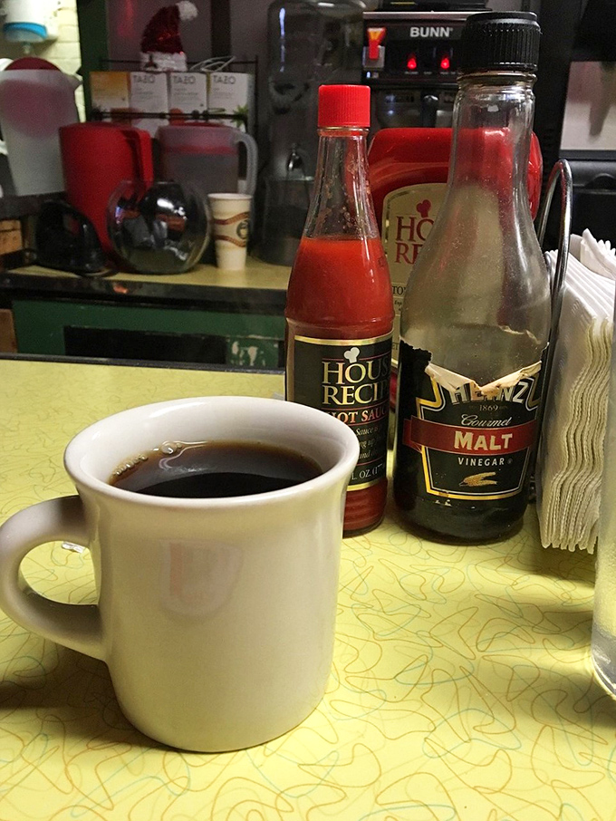 That classic white mug holds more than just coffee&mdash;it contains the lifeblood of diner culture and comes with unlimited refills of nostalgia.