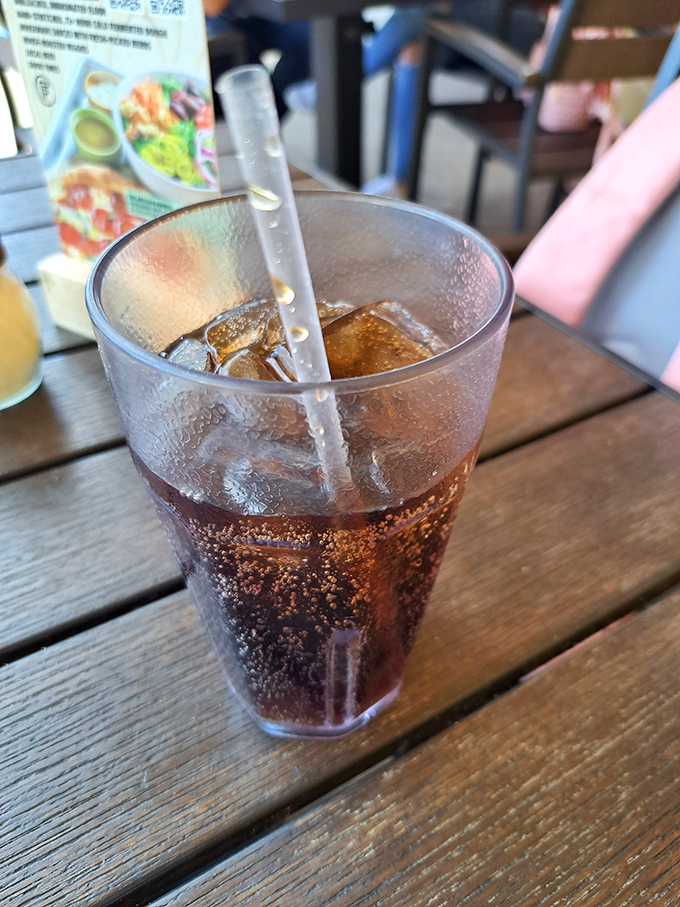 In Florida heat, this sweating glass of cola isn't just a beverage&mdash;it's survival equipment with the bonus of washing down pizza perfection.