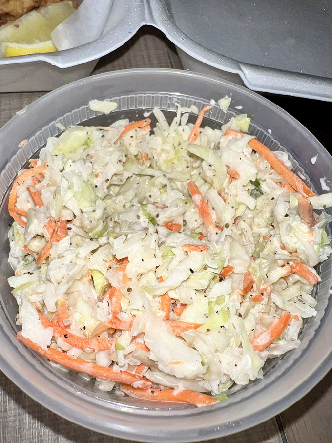 Not just any coleslaw &ndash; this crisp, fresh cabbage medley is the supporting actor that deserves its own Oscar in the seafood feast drama.