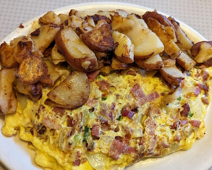 An omelet that's seen things&mdash;namely bacon, cheese, and potatoes that sacrificed themselves for the greater good of your breakfast satisfaction.