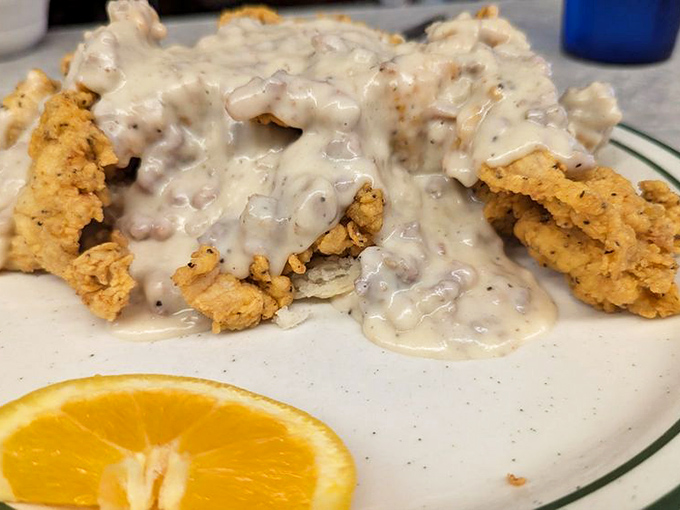 The Comfy Chicken Biscuit smothered in sausage gravy &ndash; comfort food that hugs your soul from the inside out.