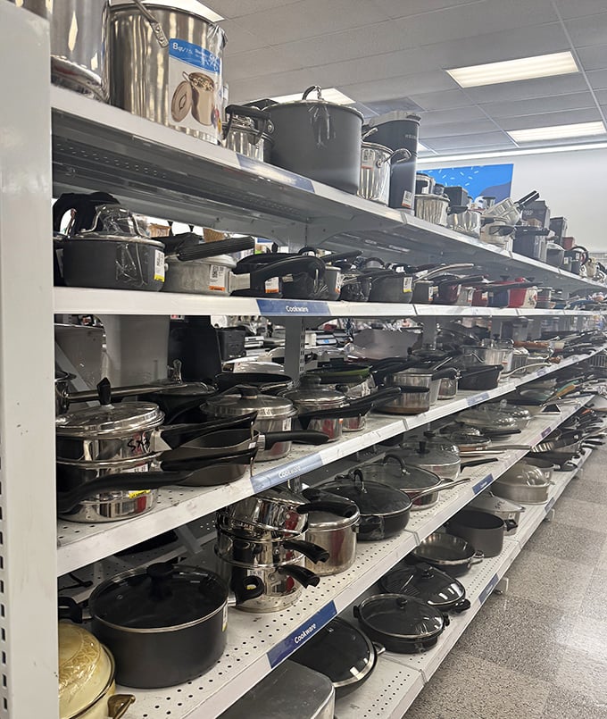 Pots and pans in various states of previous love line these shelves&mdash;each one ready to help create feasts without the first-owner price tag.